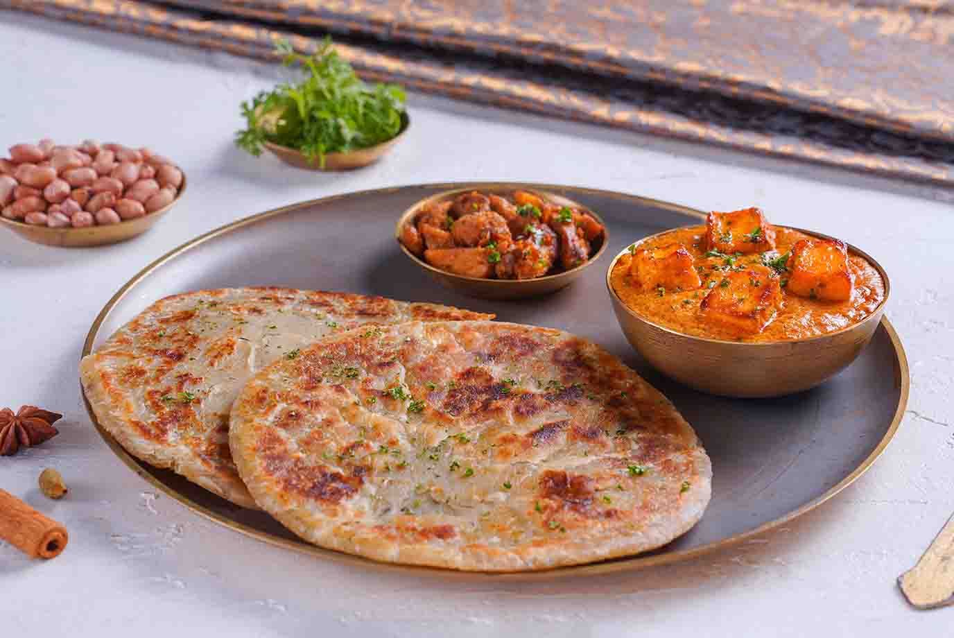 Order Singhadha Aloo Paratha 2 Pcs With Makhmali Paneer Mini Thali from ...
